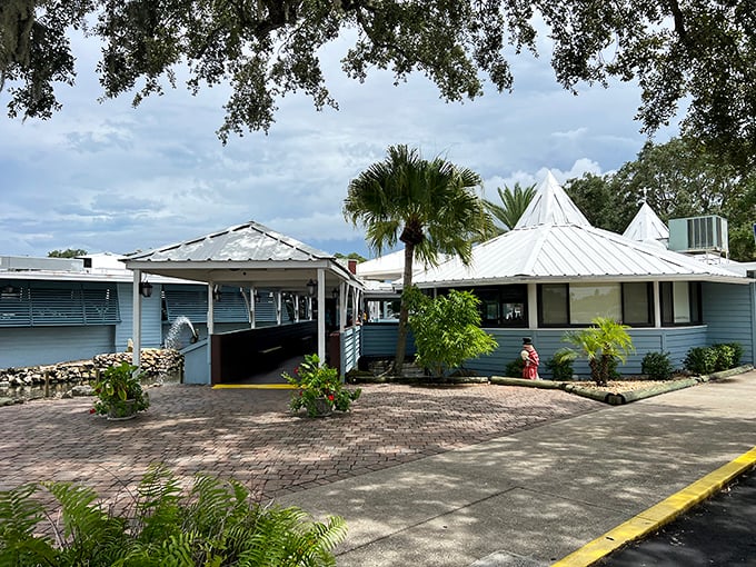 The unassuming blue exterior of Dixie Crossroads hides culinary treasures within. Like finding a pearl in an oyster, the modest façade belies the seafood magic happening inside.