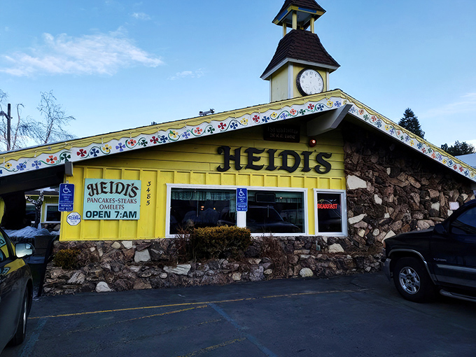 The bright yellow Alpine chalet with its charming clock tower isn't just eye-catching—it's a promise that breakfast dreams come true inside.