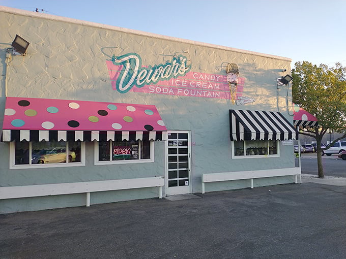 The mint-green facade with polka-dotted awnings isn't just eye-catching—it's a portal to your childhood sweet tooth memories.