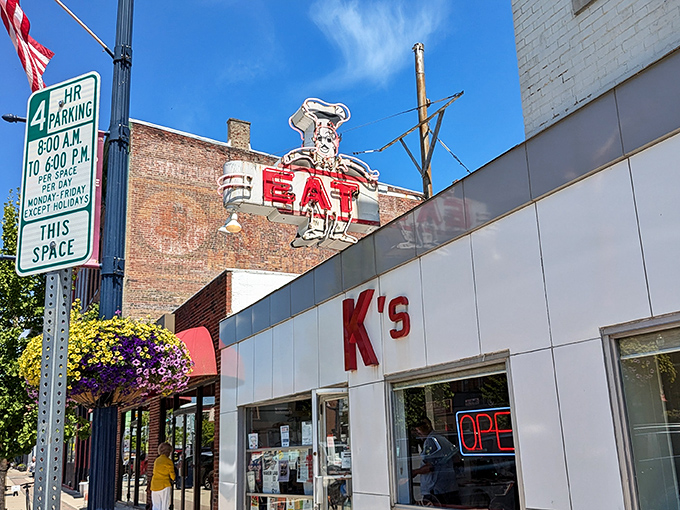 The iconic K's storefront beckons with its vintage "EAT" sign – a neon command that's impossible to ignore and even harder to disobey.