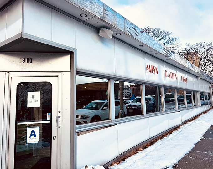 The iconic Miss Katie's Diner sign stands proud against the Milwaukee sky, a beacon of comfort food that's been drawing hungry patrons for decades.