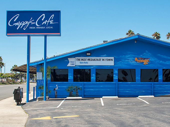 The iconic blue exterior of Cappy's Café stands out like a beacon of breakfast hope on Newport Beach's coastline.