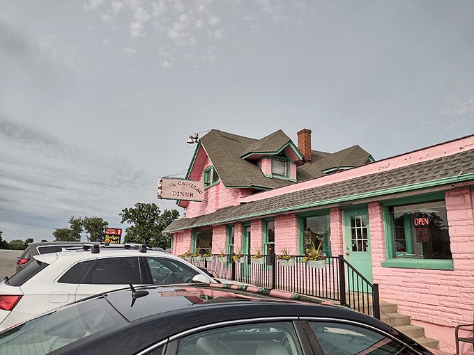 The Pink Cadillac's bubblegum-pink exterior isn't just eye-catching—it's practically a roadside siren song for hungry travelers on Route 11.