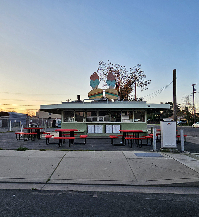 The mint green time capsule topped with those iconic burger and ice cream signs is like a beacon calling to your inner child and hungry adult self simultaneously.