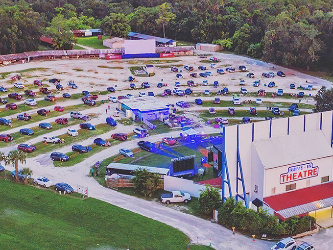 An aerial view that captures the magic of movie night under Florida stars—cars arranged like a giant game of Tetris, all facing the cinematic mothership.