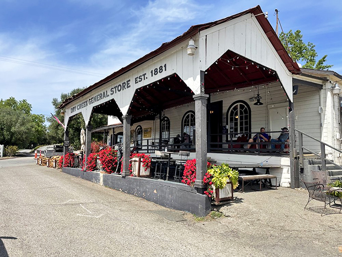 The white clapboard exterior of Dry Creek General Store beckons like an old friend with a secret to share – the best sandwich you haven't tried yet.