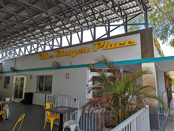 Golden script lettering and palm trees create the perfect Florida diner entrance that whispers "great food ahead."