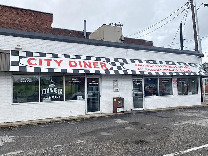 The classic black and white checkerboard awning of City Diner isn't just decoration—it's a beacon calling hungry souls to breakfast paradise in Kansas City.