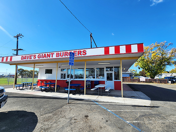 The red and white striped awning of Dave's isn't just a design choice—it's a beacon calling hungry travelers home to burger paradise.