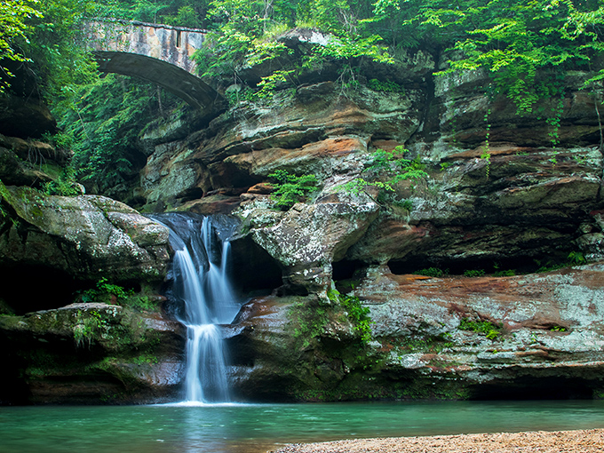 Nature's perfect waterfall doesn't exi— Oh wait, it does! Upper Falls at Old Man's Cave creates a postcard moment that no filter could improve.