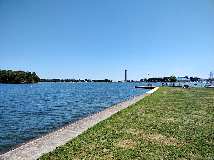 Lake Erie stretches to the horizon like nature's infinity pool, with Perry's Monument standing sentinel in the distance. Ohio's smallest state park delivers the biggest views.