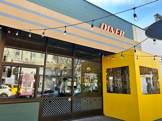 The cheerful yellow exterior of Little Goat Diner stands out like a beacon of breakfast hope on Chicago's restaurant row.