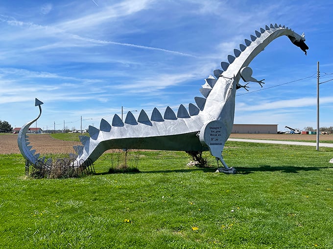 Behold the Kaskaskia Dragon in all its metallic glory, standing sentinel over Illinois farmland like a medieval fever dream.