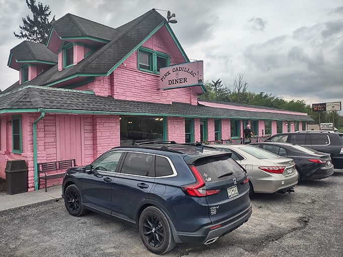 The Pink Cadillac's bubblegum-pink exterior isn't just eye-catching—it's practically a roadside siren song for hungry travelers on Route 11.