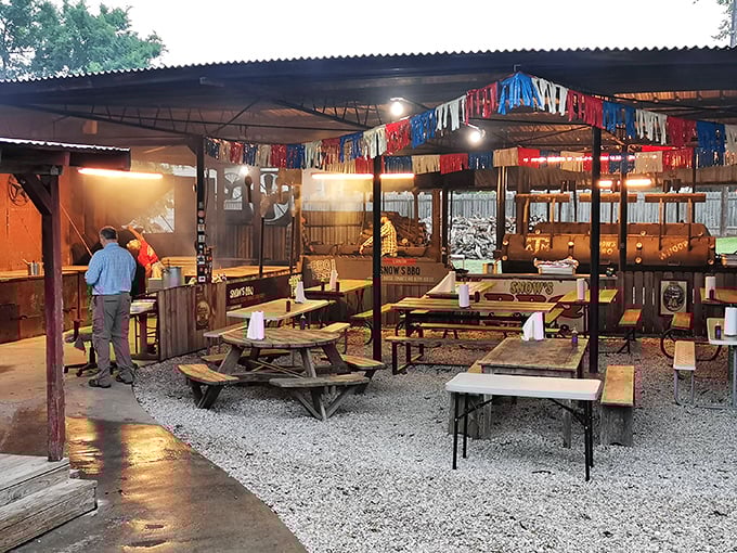 The unassuming exterior of Snow's BBQ stands like a temple of smoke in Lexington, where barbecue pilgrims gather every Saturday morning, drawn by reputation and the promise of transcendent meat.