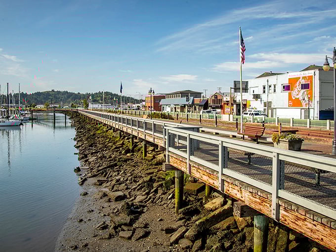 The boardwalk along Coos Bay offers that perfect blend of small-town charm and maritime bustle. Where else can you watch fishing boats while enjoying an ice cream stroll?