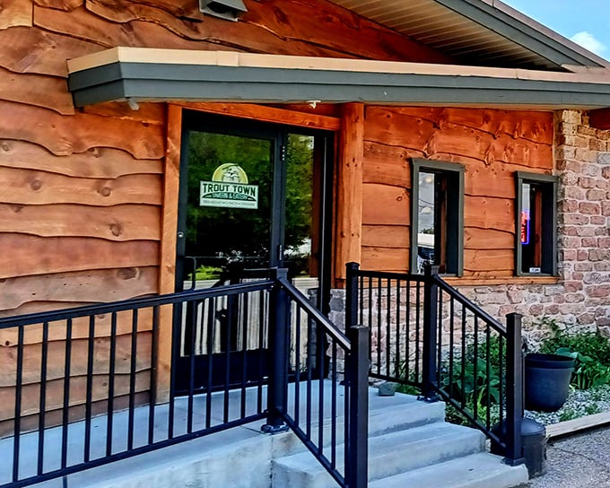The rustic log cabin exterior isn't just Instagram-worthy—it's the perfect prelude to the culinary treasures waiting inside this northern Michigan gem.