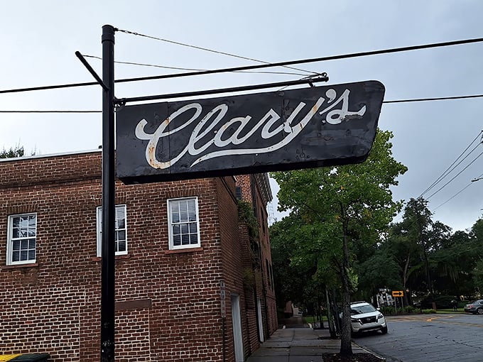 The iconic black sign beckons like an old friend against Savannah's brick backdrop. Some restaurants need flashing lights – Clary's just needs its reputation. P