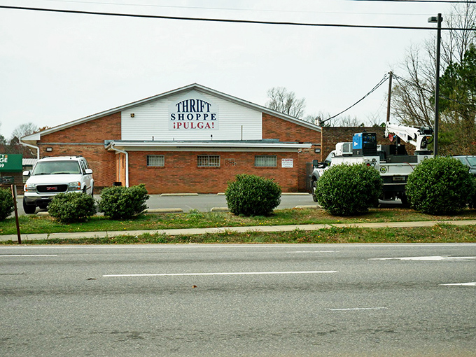 The unassuming brick exterior hides a treasure trove within. Like finding a secret passage in your childhood home, this thrift store promises adventures beyond its modest façade.