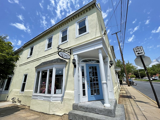 The charming pale yellow exterior with its distinctive blue door invites you into a world where French technique meets Pennsylvania hospitality.