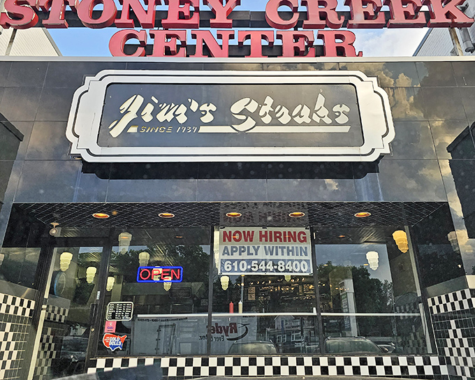 Jim's Steaks welcomes hungry visitors with its classic storefront in Stoney Creek Center. The checkered trim hints at the culinary treasures waiting inside.