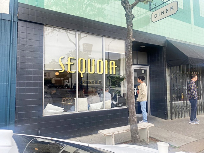A simple sign reading "DINER" against turquoise tiles tells you everything you need to know—culinary treasures often hide behind the most unassuming facades.