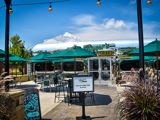 The outdoor patio at Roger's Diner feels like summer vacation incarnate – complete with string lights that promise evening magic under North Carolina skies.