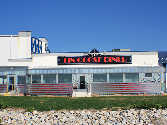 The gleaming stainless steel exterior of Tin Goose Diner shines like a beacon of hope for hungry travelers. Mid-century Americana at its finest.