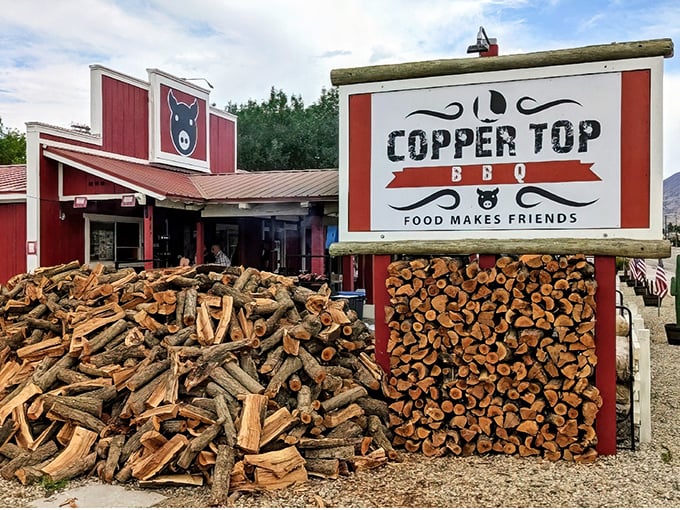 The woodpile outside Copper Top BBQ isn't just for show—it's the secret ingredient that transforms ordinary meat into smoky perfection.