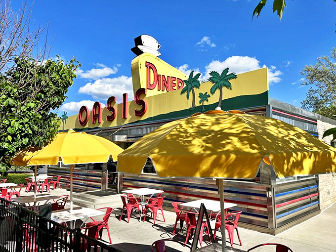 The sunshine-yellow exterior of Oasis Diner isn't just eye-catching—it's a time machine disguised as a restaurant on Plainfield's Historic National Road.