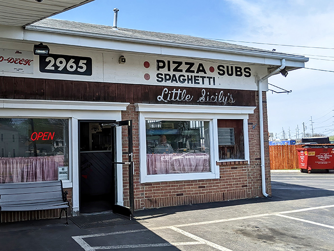 The unassuming brick façade of Little Sicily's might not stop traffic, but locals know this modest storefront houses pizza treasures worth slamming on the brakes for.