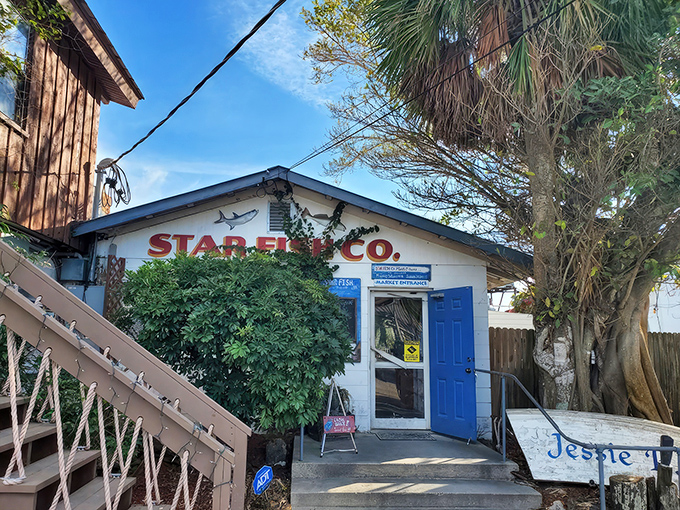 The unassuming entrance to seafood paradise – where that bright blue door might as well be a portal to flavor country.