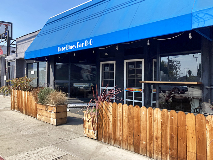 That iconic blue awning stands as a beacon of barbecue bliss on Lincoln Boulevard, calling hungry pilgrims to worship at the altar of smoke.