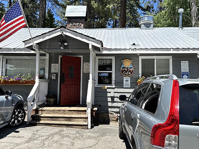 The unassuming exterior of Fire Sign Café stands like a breakfast speakeasy among Tahoe pines, its red door a portal to pancake paradise.