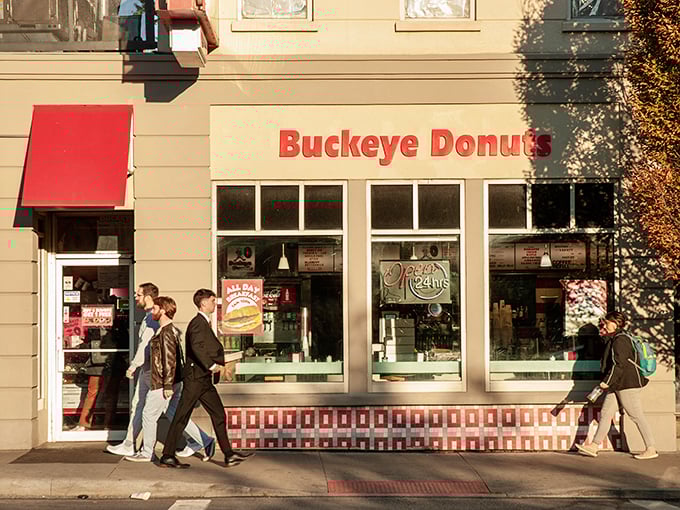 The iconic Buckeye Donuts storefront stands proudly on High Street, its vintage neon sign a beacon of hope for the hungry at any hour.
