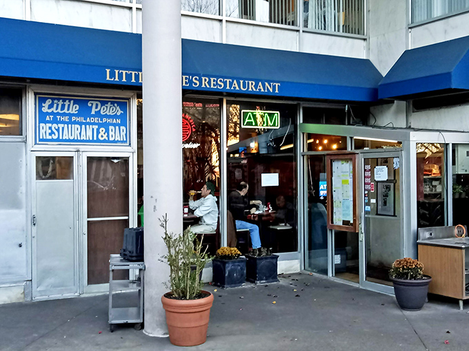 Little Pete's iconic blue awning beckons hungry Philadelphians like a culinary lighthouse. This unassuming storefront houses flavor treasures worth their weight in cheesesteak gold.