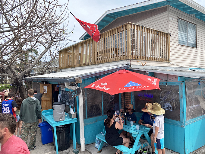 The turquoise beacon of burger paradise stands proudly on Holmes Beach, where the American flag waves as if to say, "Yes, this is what freedom tastes like."