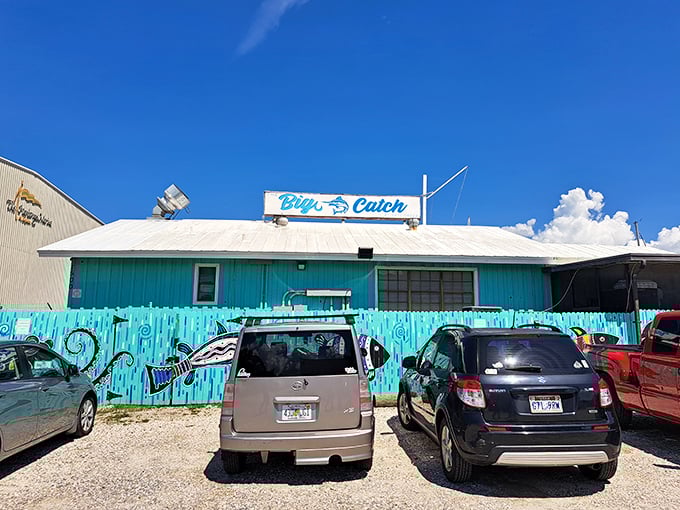 The turquoise facade of The Big Catch at Salt Creek isn't trying to hide – it's proudly announcing that Florida seafood paradise awaits inside.