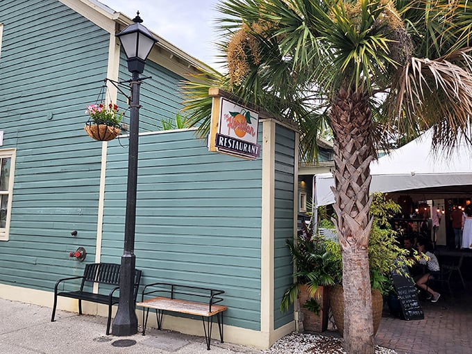 The seafoam-green exterior of The Floridian stands like a culinary lighthouse in St. Augustine's historic district, beckoning hungry travelers with Southern charm.