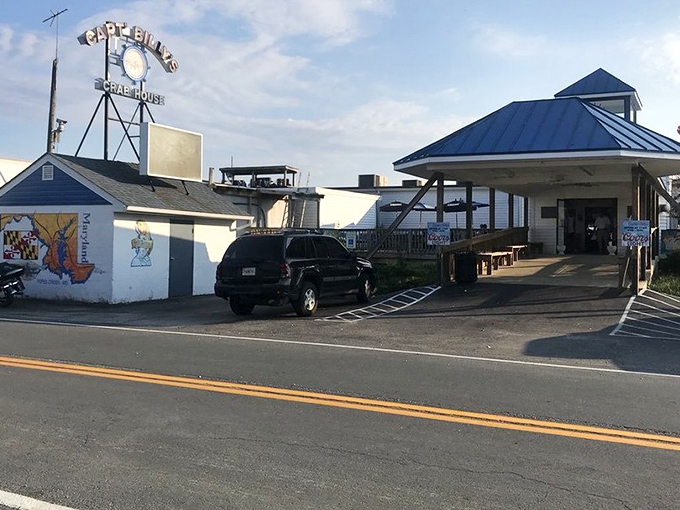 The iconic roadside sign beckons like a siren call to seafood lovers – Captain Billy's stands ready to welcome hungry travelers to crab paradise.