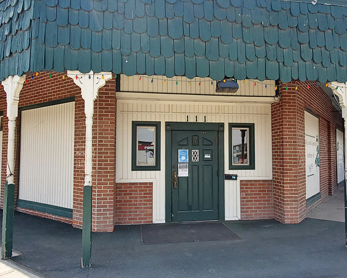 The unassuming exterior of Mackey's beckons like a lighthouse for hungry travelers. That glowing sign promises steak salvation in Ontario's quieter corner.