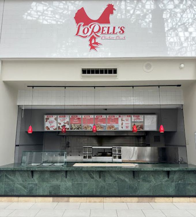 The iconic red chicken logo of LoRell's beckons from its clean, minimalist storefront—proof that greatness doesn't need flashy advertising.