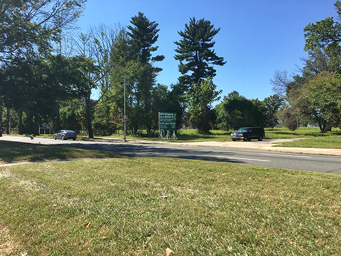 The unassuming entrance to Benjamin Rush State Park – where Philadelphia's concrete jungle gives way to towering pines and open skies. Nature's front porch awaits.