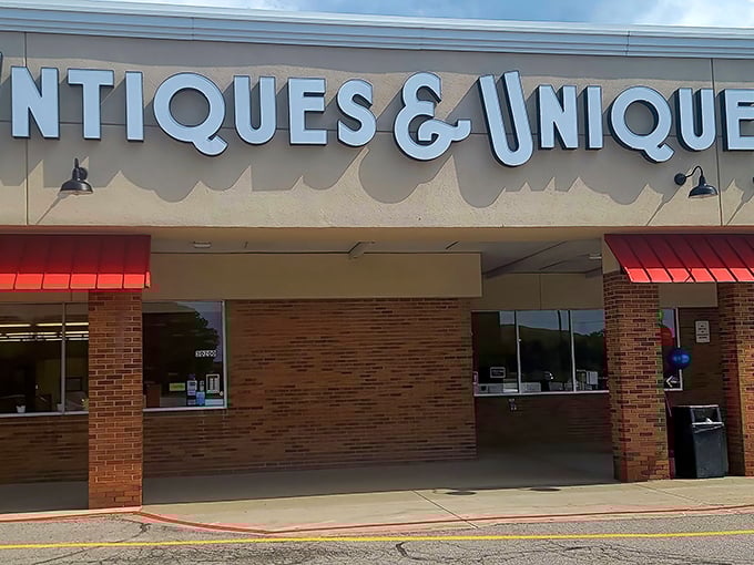 The storefront beckons with its bold signage and cherry-red awnings—like a time machine disguised as a strip mall tenant.