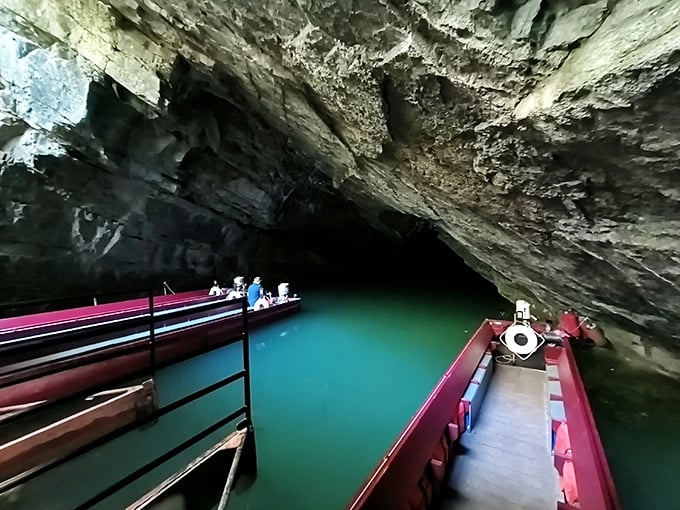 Nature's grand entrance beckons as emerald waters meet ancient limestone. Like stepping into Earth's own cathedral, complete with a baptismal font that's been 400 million years in the making.