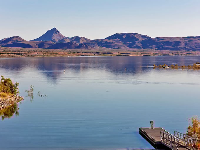 Mirror-like waters reflecting rugged mountains—nature's own infinity pool without the pretentious cocktail prices or dress code requirements.
