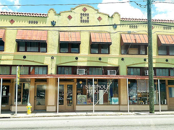 The historic facade of Retro Mania Vintage Market stands proudly in Tampa's Seminole Heights, its Spanish-influenced architecture and terracotta awnings practically whispering "come treasure hunting."