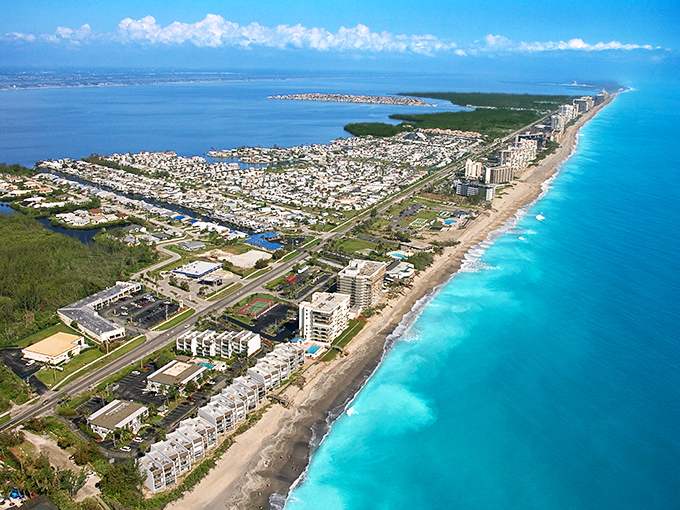 From this aerial view, Jensen Beach looks like Florida's best-kept secret – where turquoise waters meet small-town charm without the tourist stampede. 