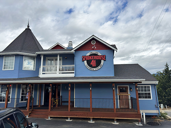 That blue Victorian charm meets serious barbecue business – where fairy tale architecture houses smoky dreams. 