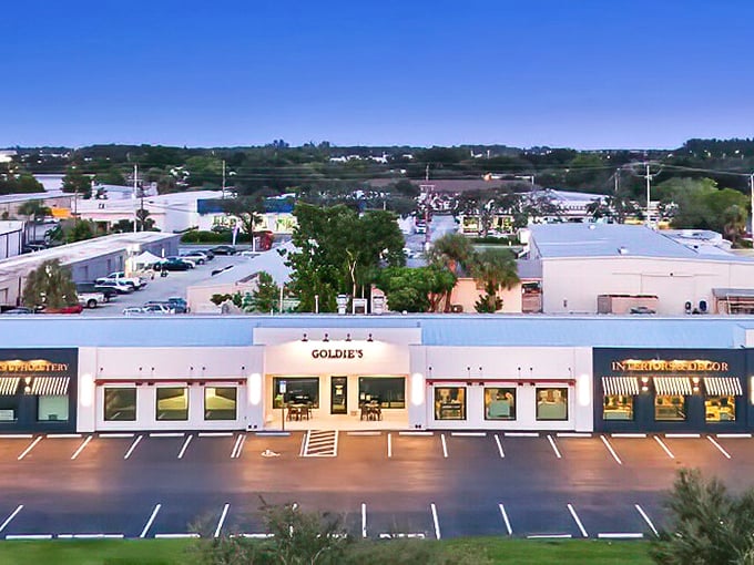Goldie's unassuming white exterior might fool you, but those vintage gooseneck lights are practically winking, "Trust me, the breakfast magic happens inside."